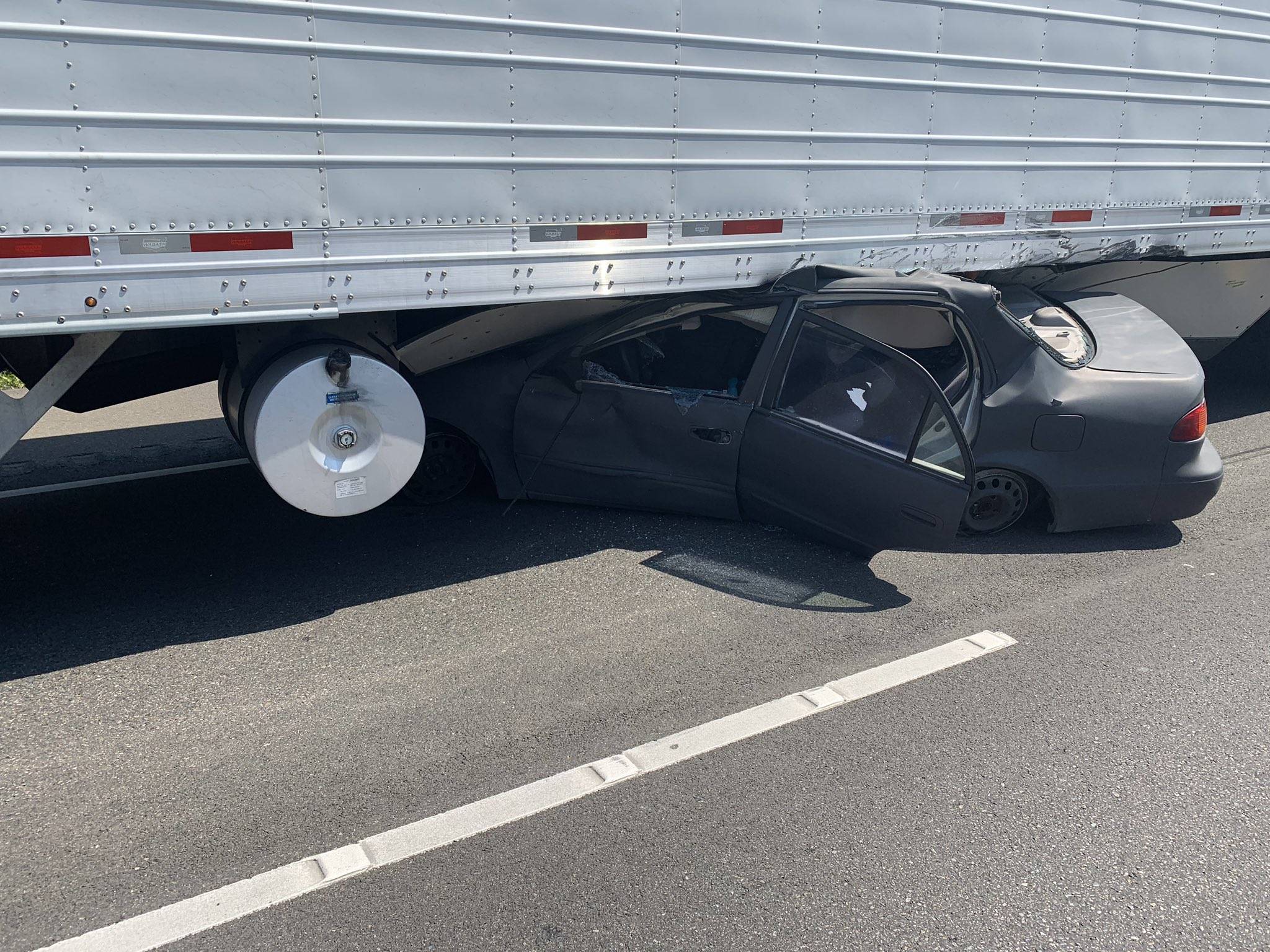 Semi collision leaves car stuck underneath | Renton Reporter